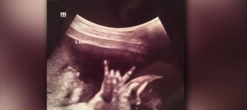 This baby throwing up metal horns in the womb is the future of rock