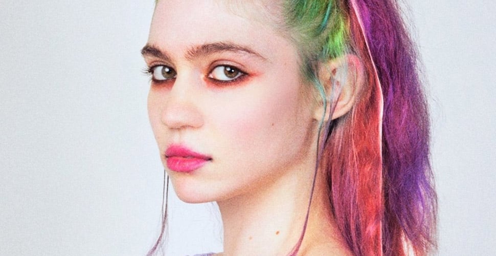 Grimes has unveiled a hectic "alien scars" full back tattoo