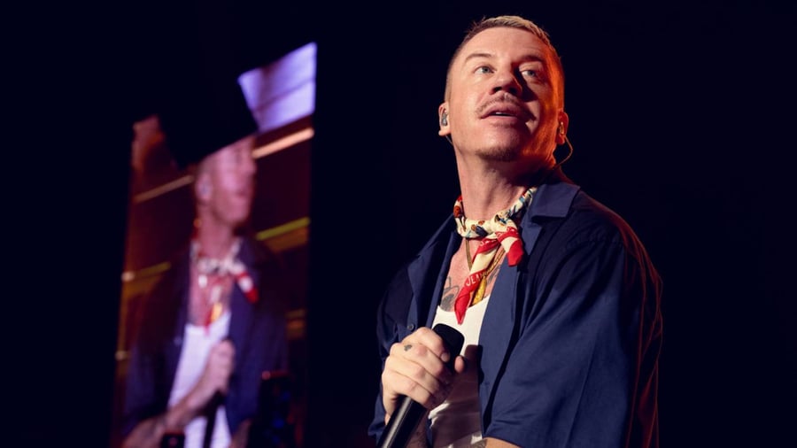 Macklemore Explains 'F-ck America' Comment, Is 'Unwavering' in 'Support ...